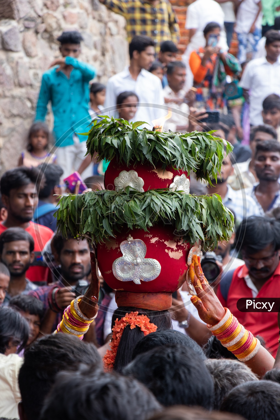 Image of A Woman Carrying Bonam or Bonalu On Her Head At Golconda ...