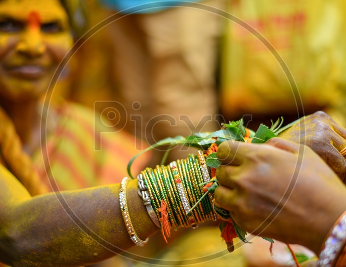 Image of Kankanam Or Hand Bands Being Tie To Wrists During Bonalu ...