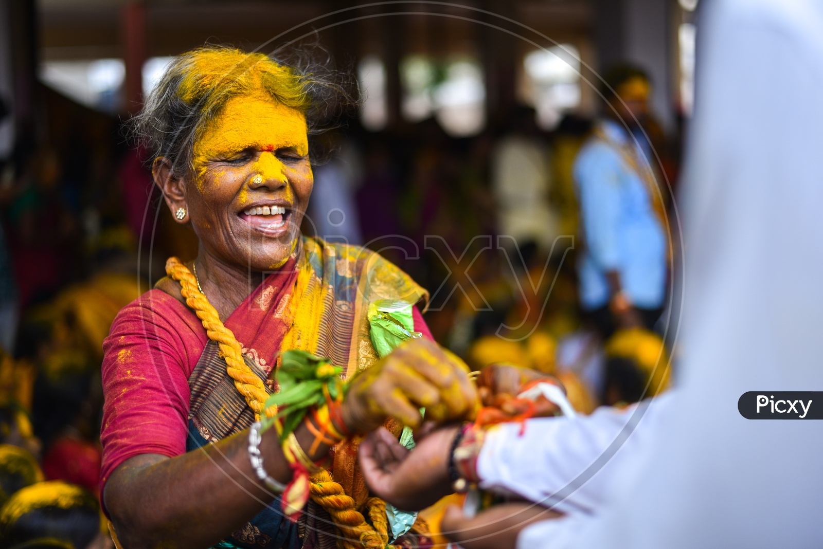 Image of Kankanam Or Hand Bands Being Tie To Wrists During Bonalu ...
