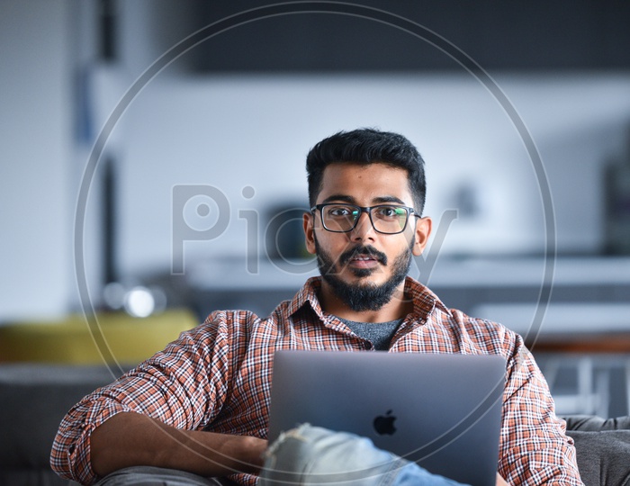 Image of Young Man or Indian Man Working On Laptop Posing Serious ...