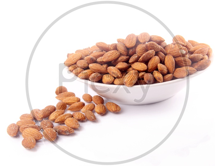 Image of Roasted Almonds Or Badam Nuts In a Bowl On an Isolated White ...