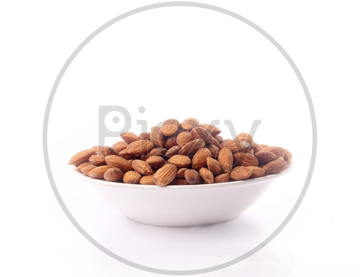 Image of Roasted Almonds Or Badam Nuts In a Bowl On an Isolated White ...
