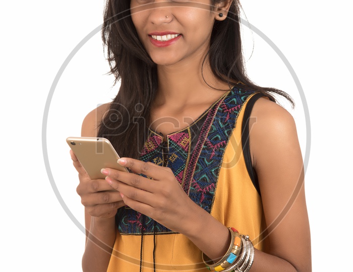 Image of Young Indian Girl Using Mobile Or Smartphone On an Isolated ...