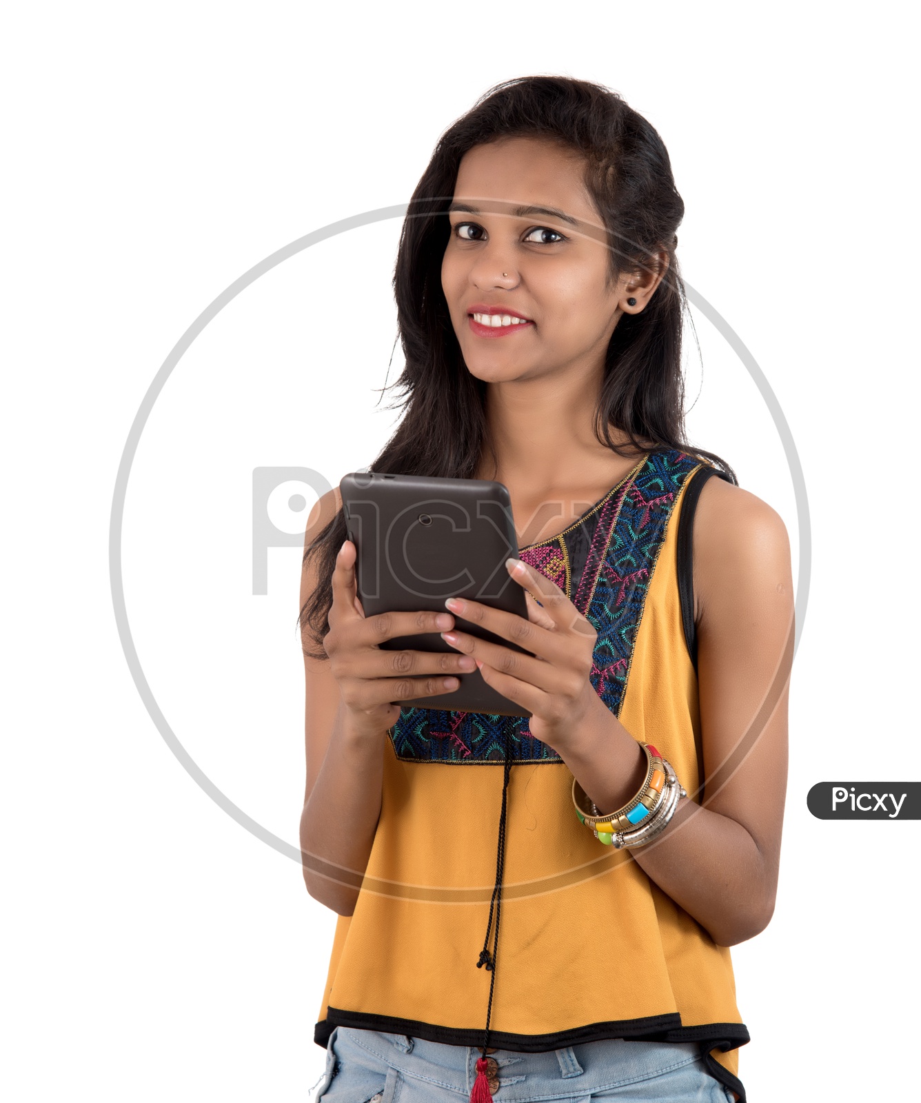Image of Young Indian Girl Using Tab Or Tablet Gadget on an Isolated White Background-EI361474-Picxy