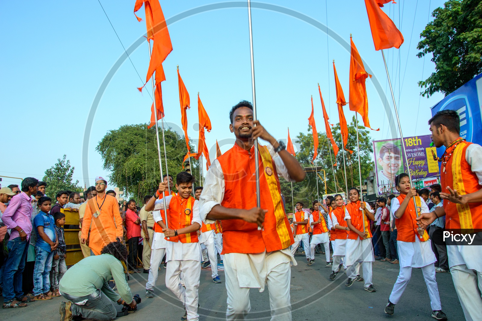 Image of A Group of Man Performing And Dancing On the Streets Holding ...
