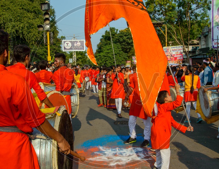Image of A Group of Man Performing And Dancing On the Streets Holding ...