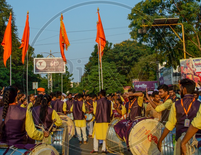 Image of A Group of Man Performing And Dancing On the Streets Holding ...