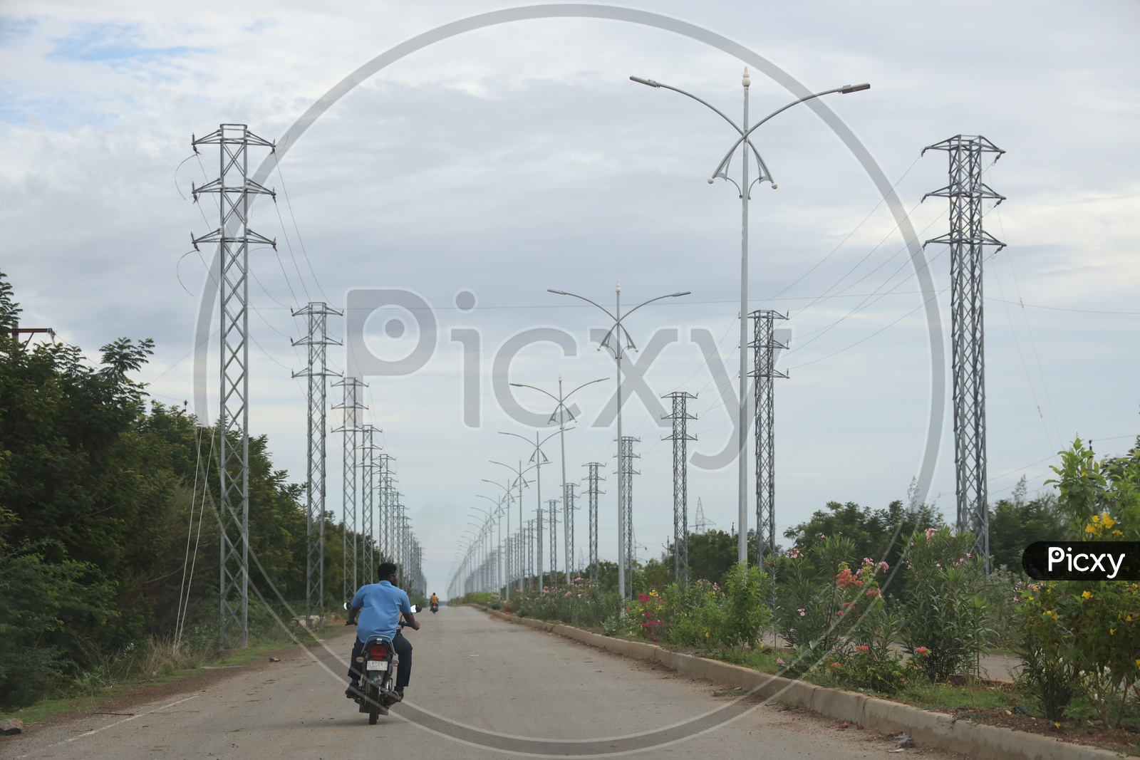 Image of Biker Commuters On Menakuru SEZ Road-HX206976-Picxy