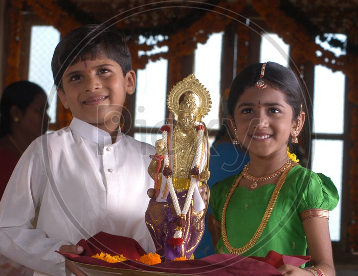 Image of Young Children Carrying Golden Idol of Lord Rama-VC390608-Picxy