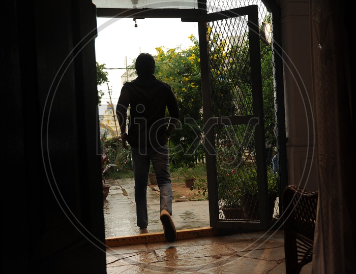 Image of A man leaving the House-SN828203-Picxy