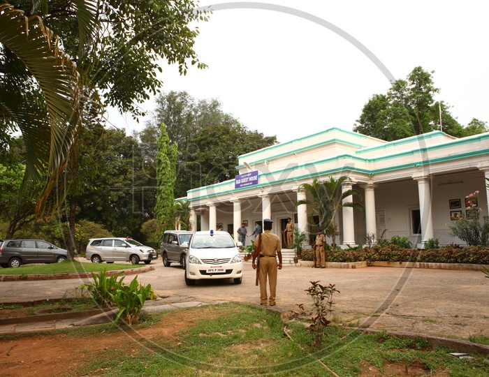 Image of Police Guards Security At a House With Guns-IK881143-Picxy