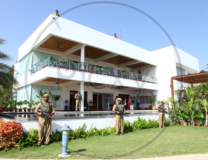Image of Police Guards Security At a House With Guns-IK881143-Picxy
