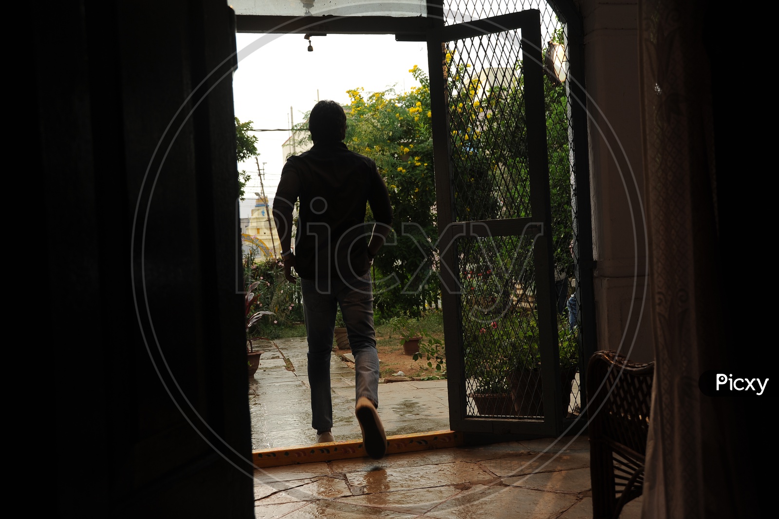 Image of A man leaving the House-SN828203-Picxy