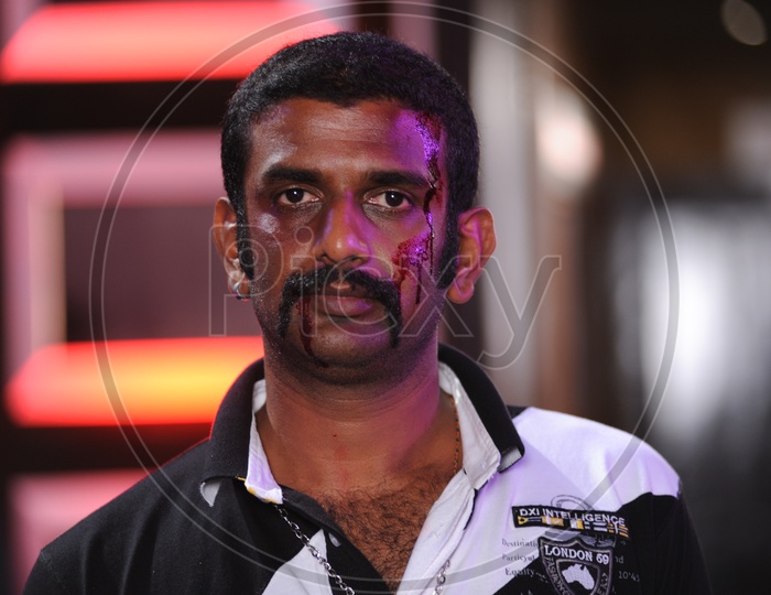 Image of A Man With Blood Stains On Face-AK313523-Picxy