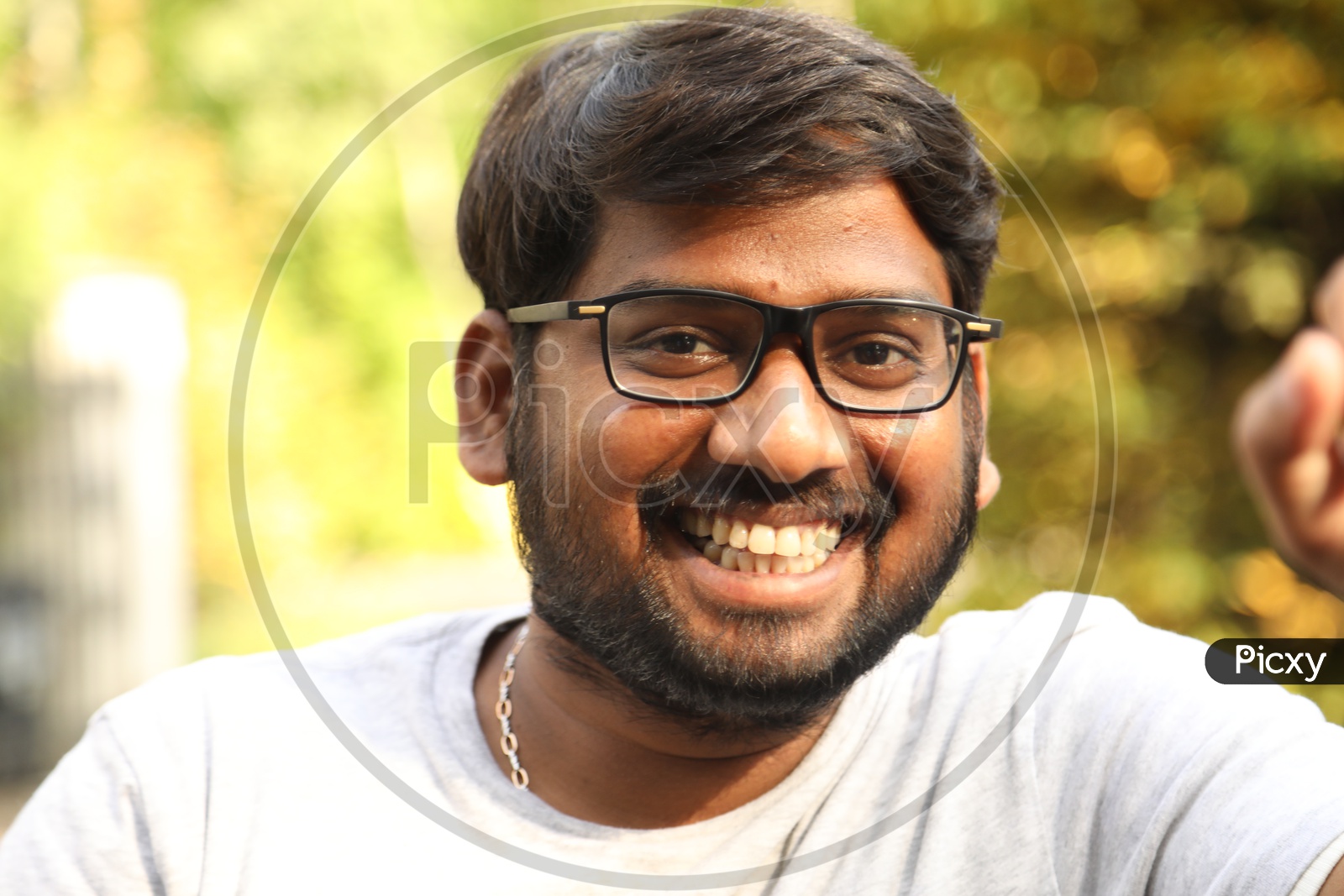 Image of Young Indian Man Posing With a Smile Face-ZV974703-Picxy