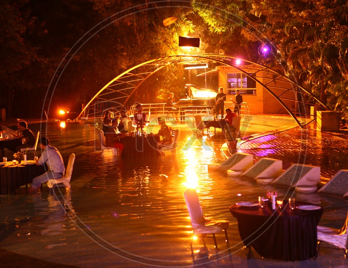 Image of Water Based Theme Restaurant in Night With Live Music-RH897879 ...