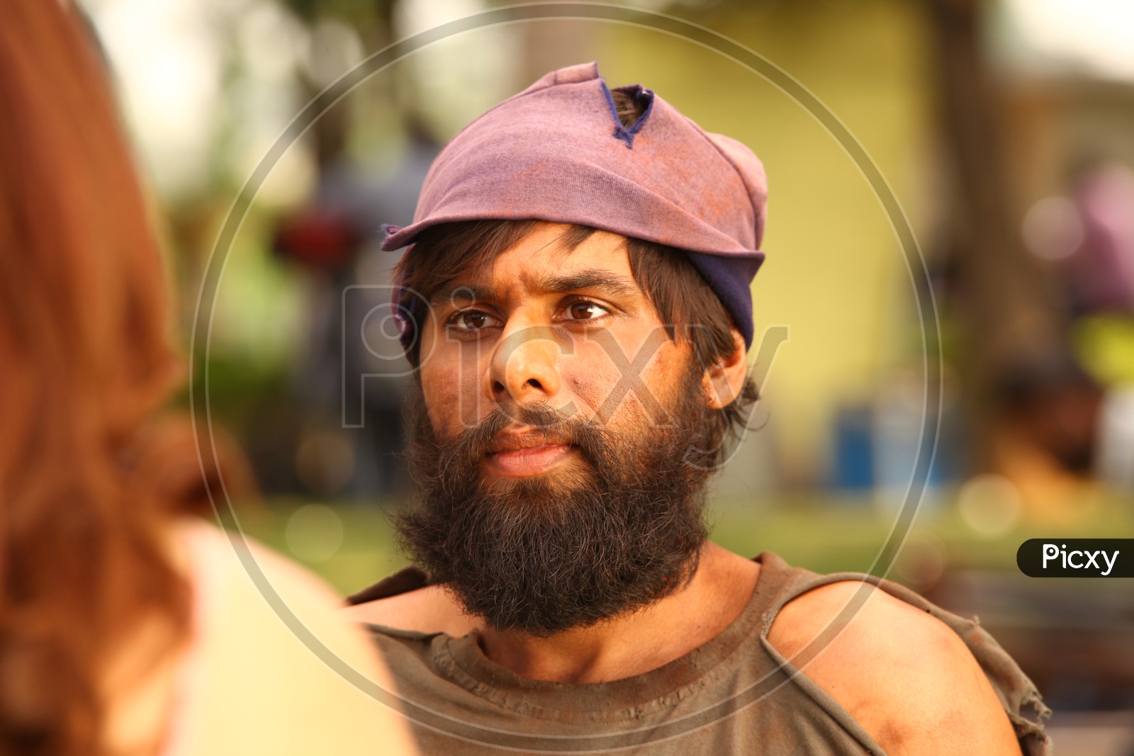 Image of Young Man In Beggar Getup For a Movie Shooting-EV841828-Picxy