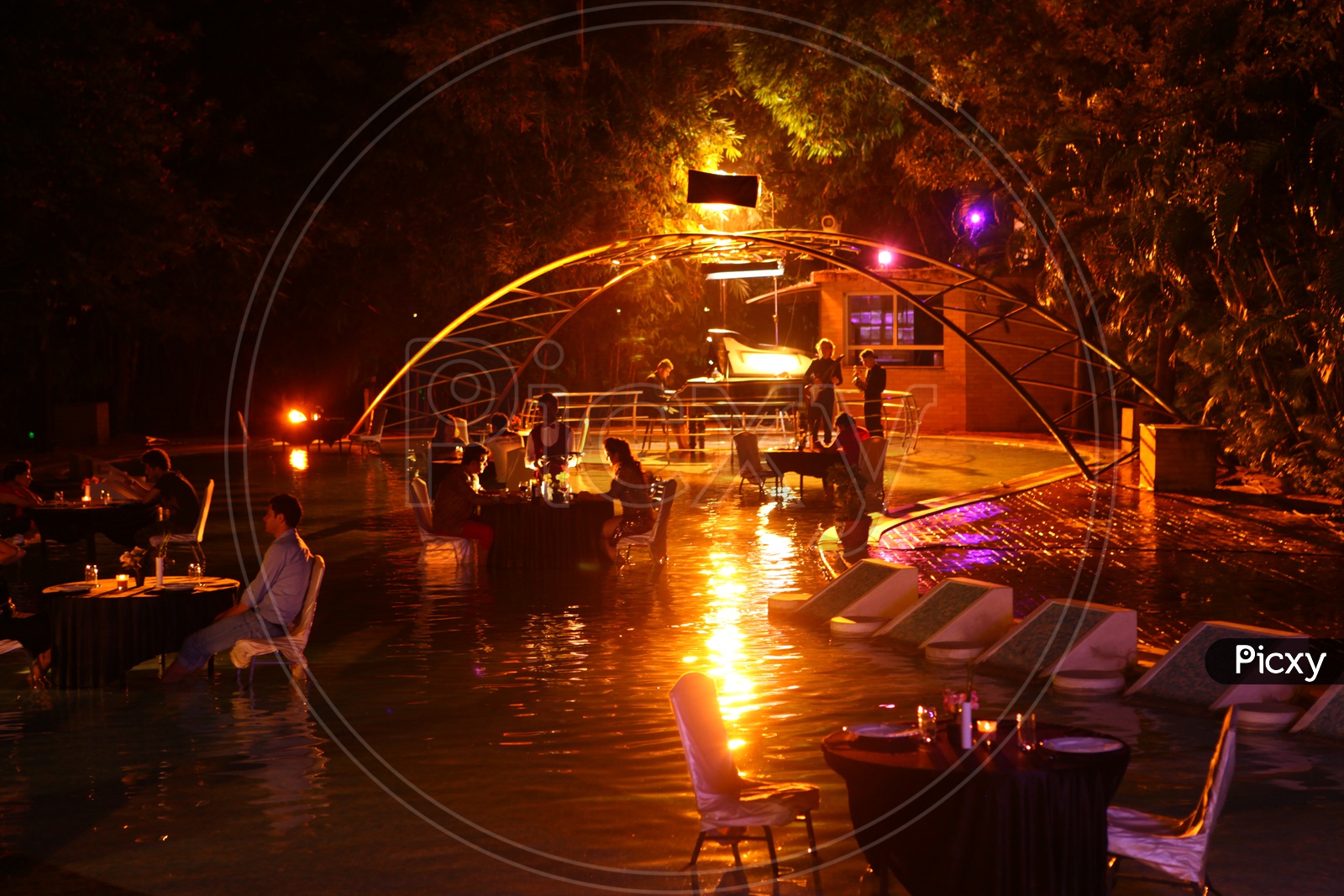 Image of Water Based Theme Restaurant in Night With Live Music-DU422392 ...