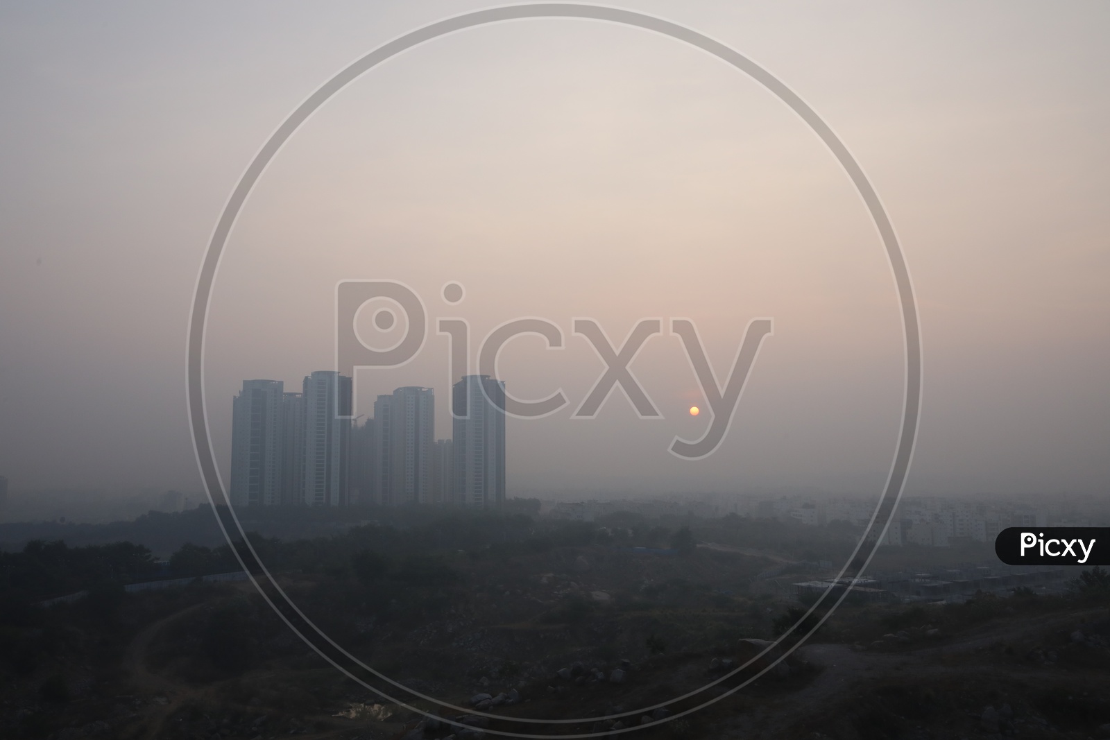 Image of A View of High Rise Apartment Buildings from a Hill top With ...