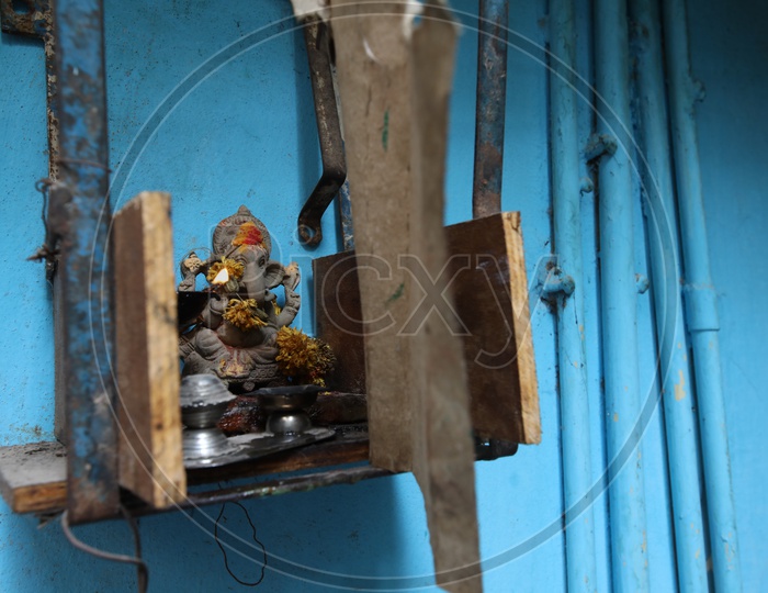 Image of Lord Ganesh idol With Pooja Dia In a House-KF256129-Picxy