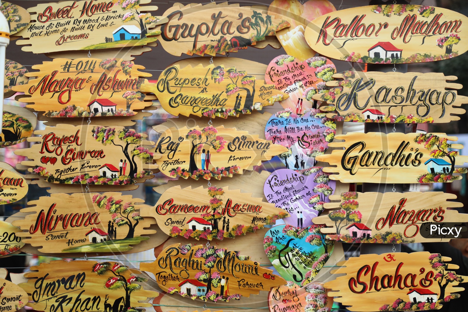 Image of Wooden Carved Name Boards In Exhibition Fair-EB943089-Picxy