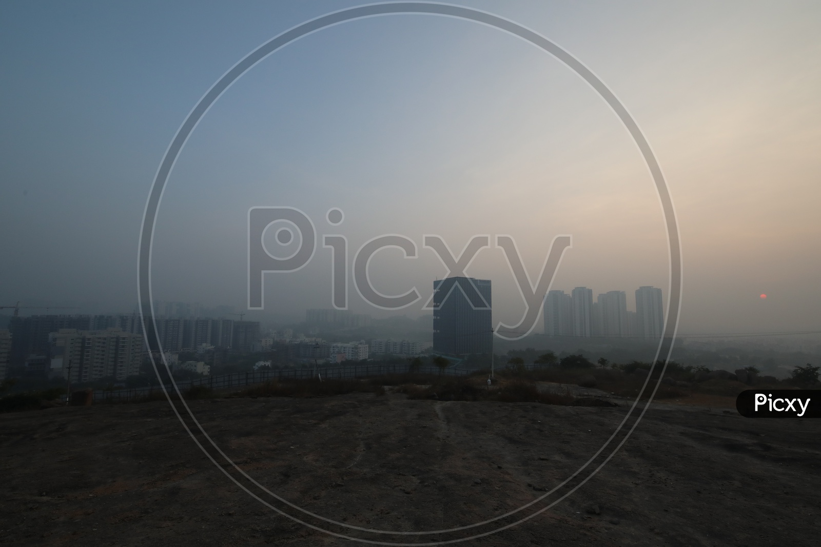 Image of A View of High Rise Apartment Buildings from a Hill top With ...