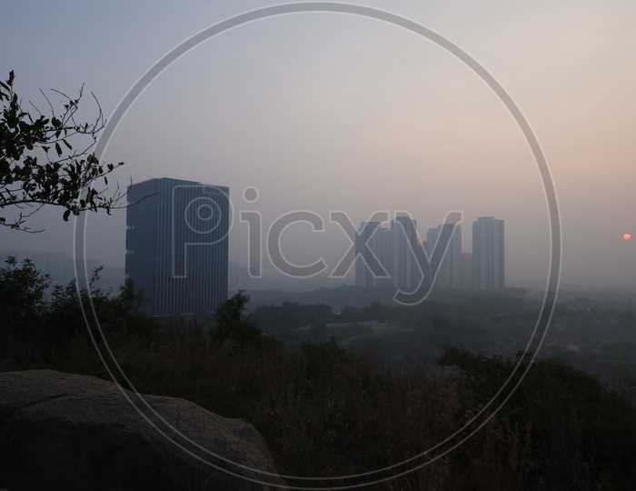Image of A View of High Rise Apartment Buildings from a Hill top With ...