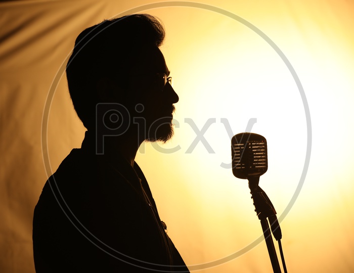 Image of Silhouette of a Male Singer Singing-YW511306-Picxy