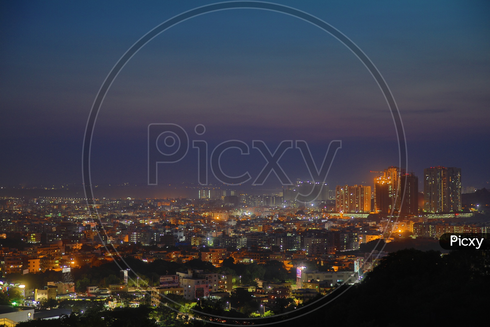 Image of Night Scape Of A City with High Rise Buildings And City Lights ...