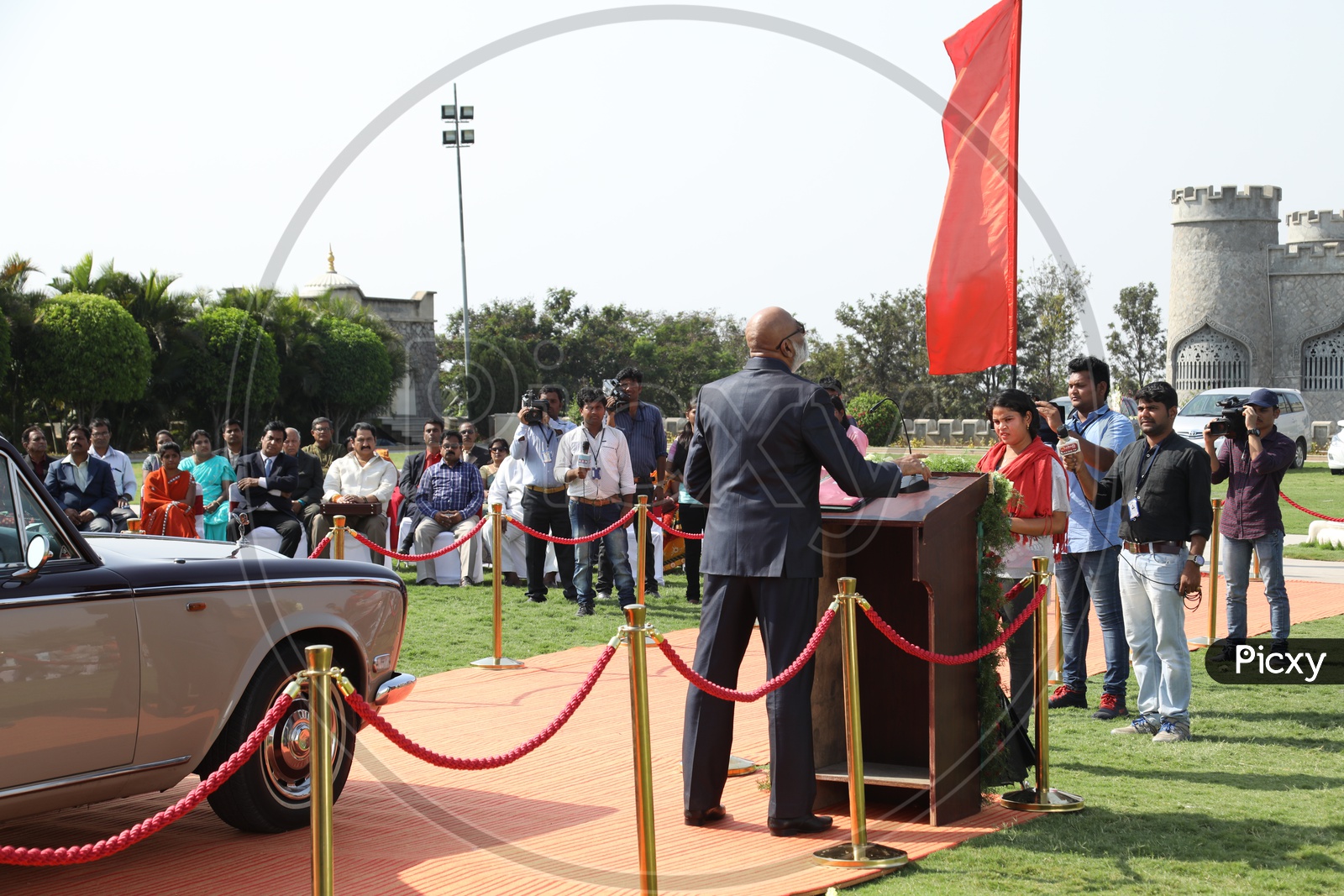 Image of Indian Man Speaking At Dias At a Car Auction-FW279758-Picxy
