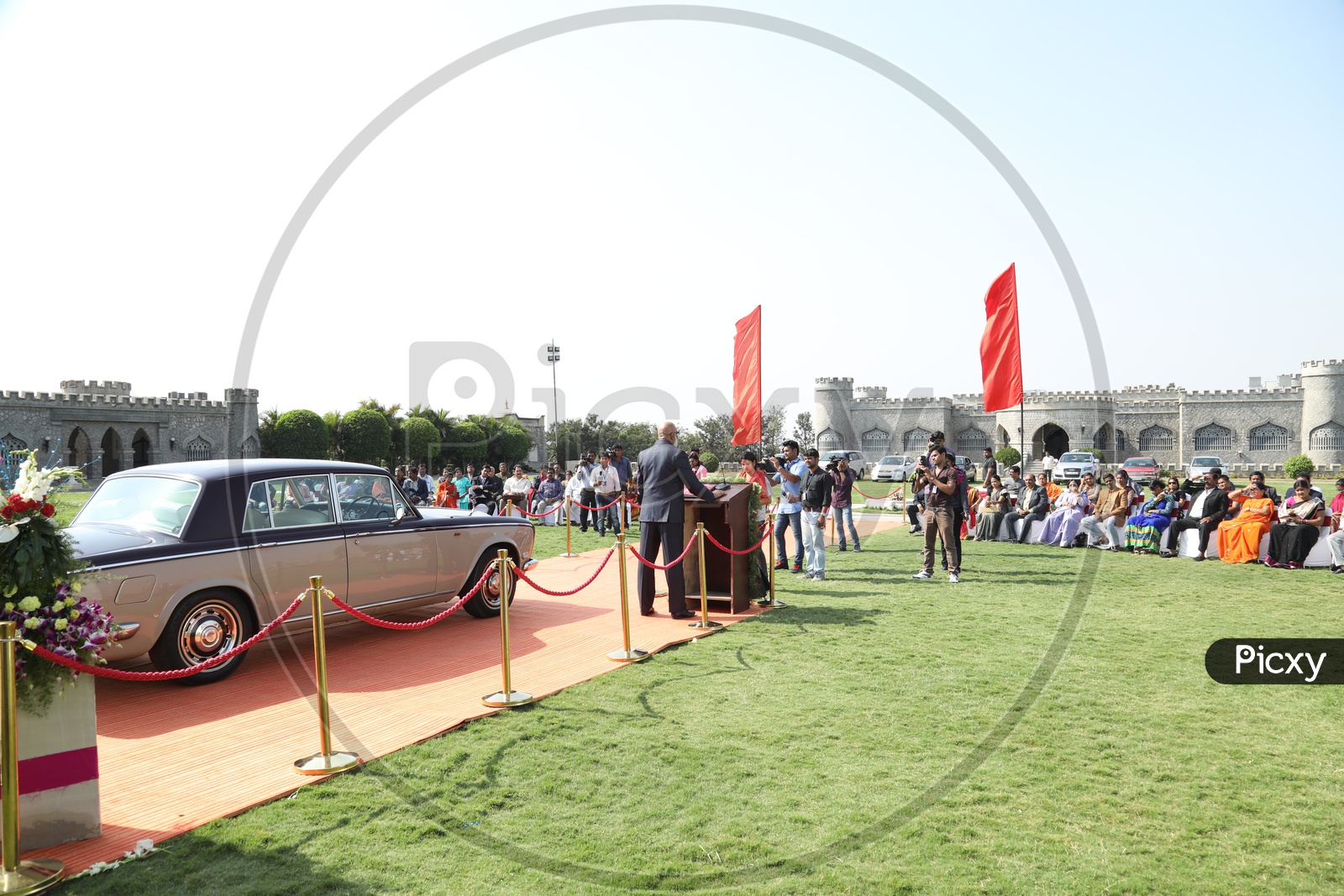 Image of Indian Man Speaking At Dias At a Car Auction-DT964648-Picxy