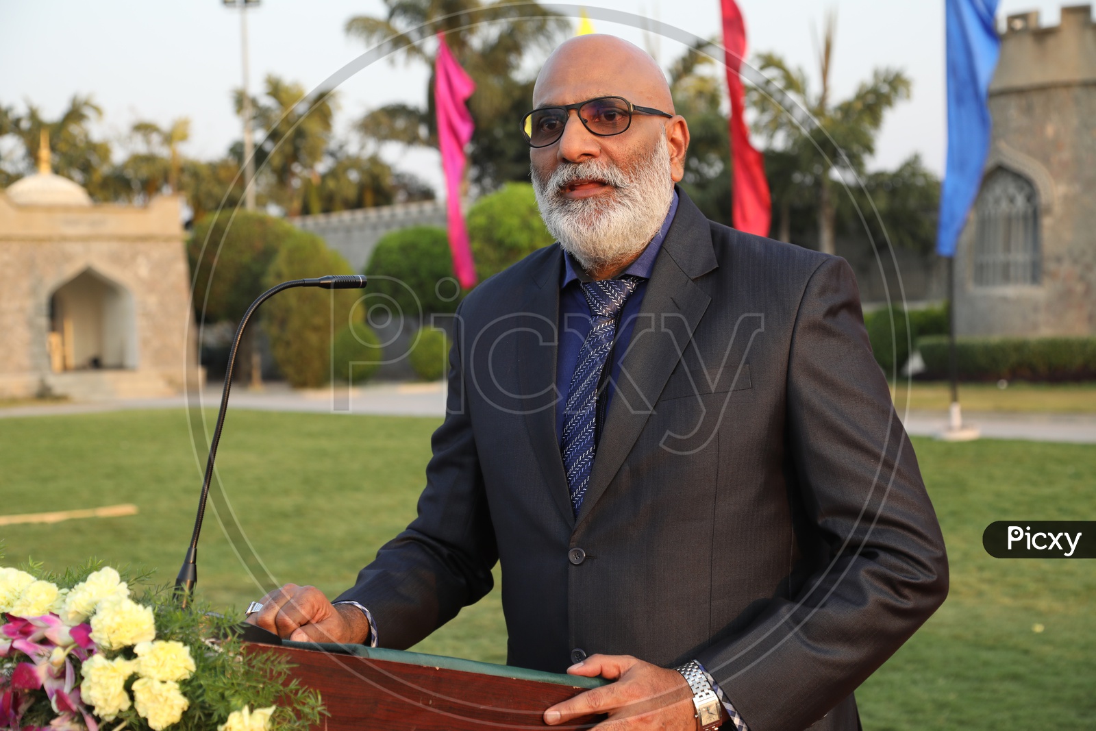 Image of Indian Man With Beard Speaking At a Dias on Stage-FB877528-Picxy