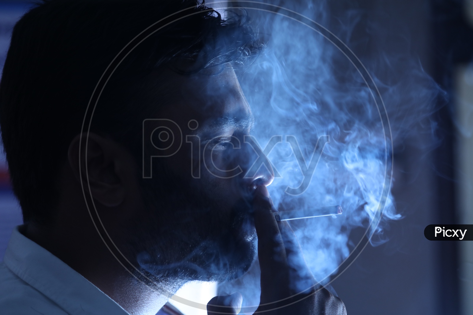 Image of Indian Man Smoking Cigarette-XZ117050-Picxy