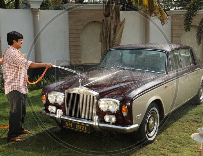 Image of Rolls Royce Car Washing By a Cleaner-HK061452-Picxy