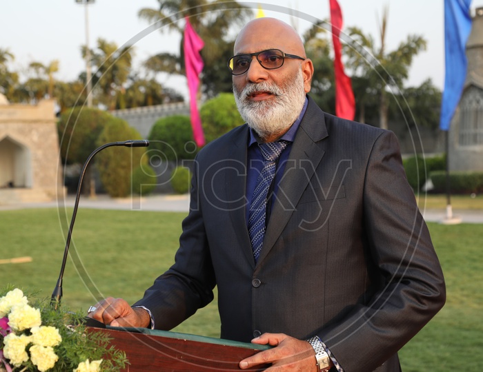 Image of Indian Man With Beard Speaking At a Dias on Stage-FB877528-Picxy
