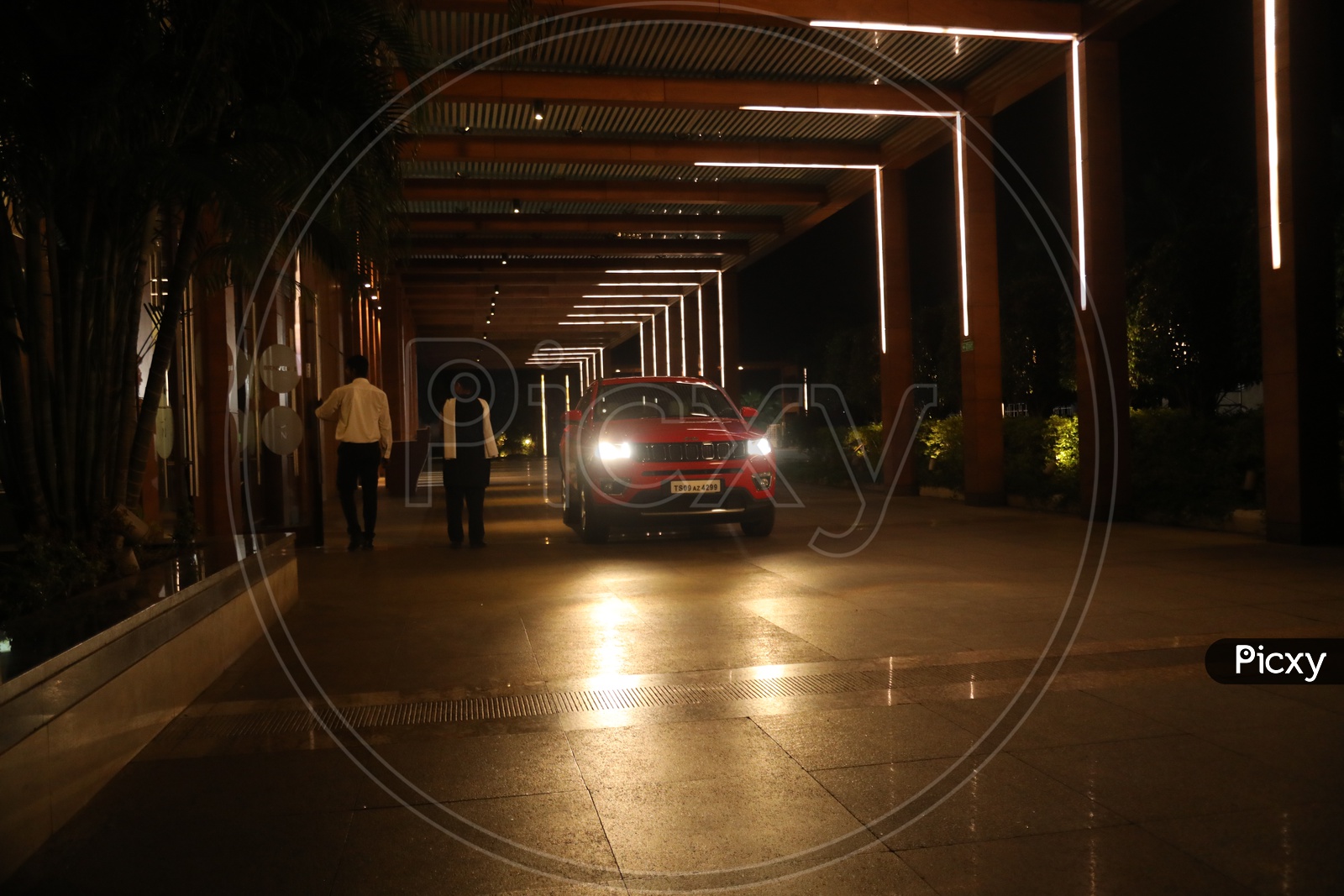 Image of A Car Entering to a Lobby Of a Hotel Or Residency-ON201145-Picxy