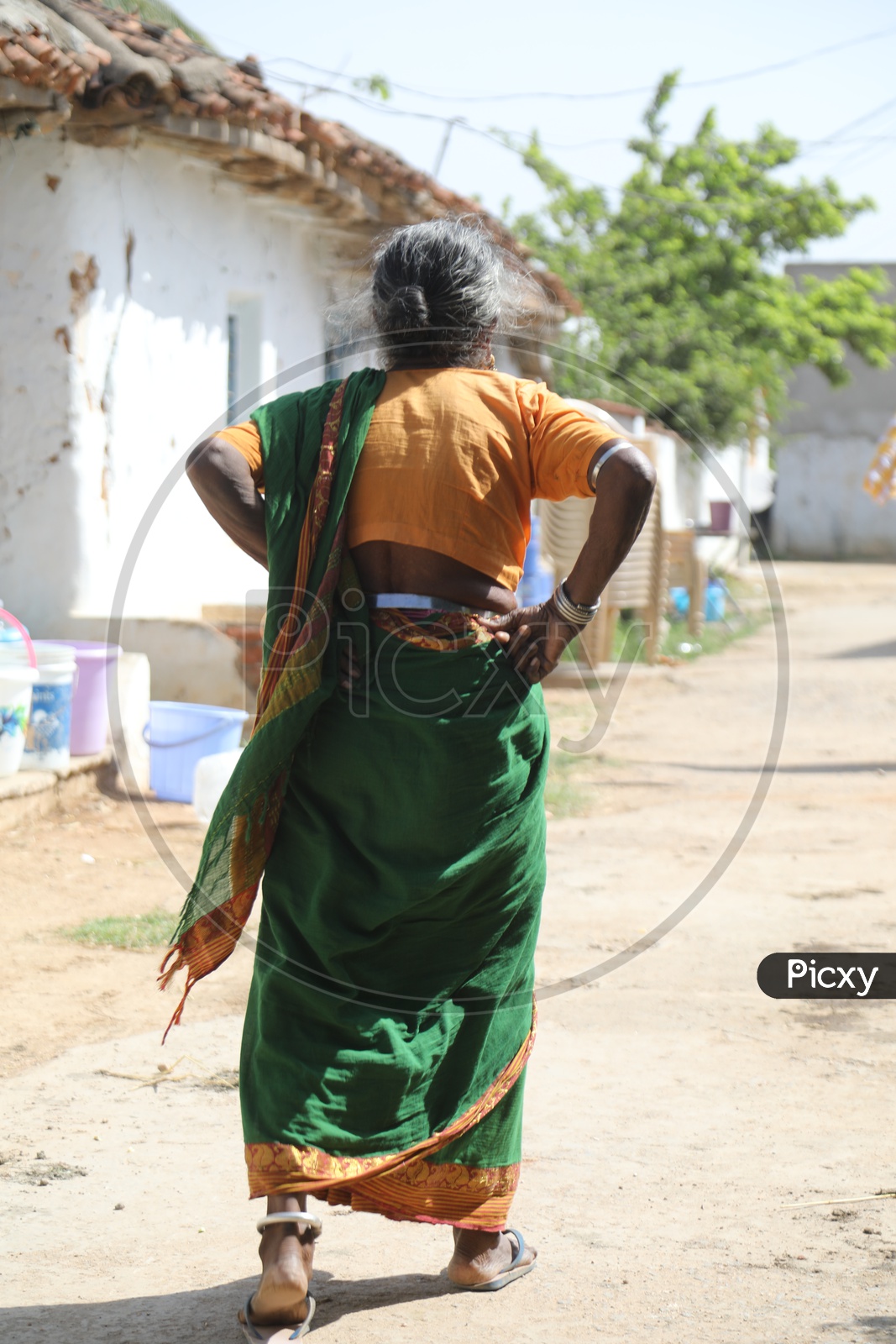 Image of An Old Woman of a Rural Village at Her House Premise-YG018227 ...