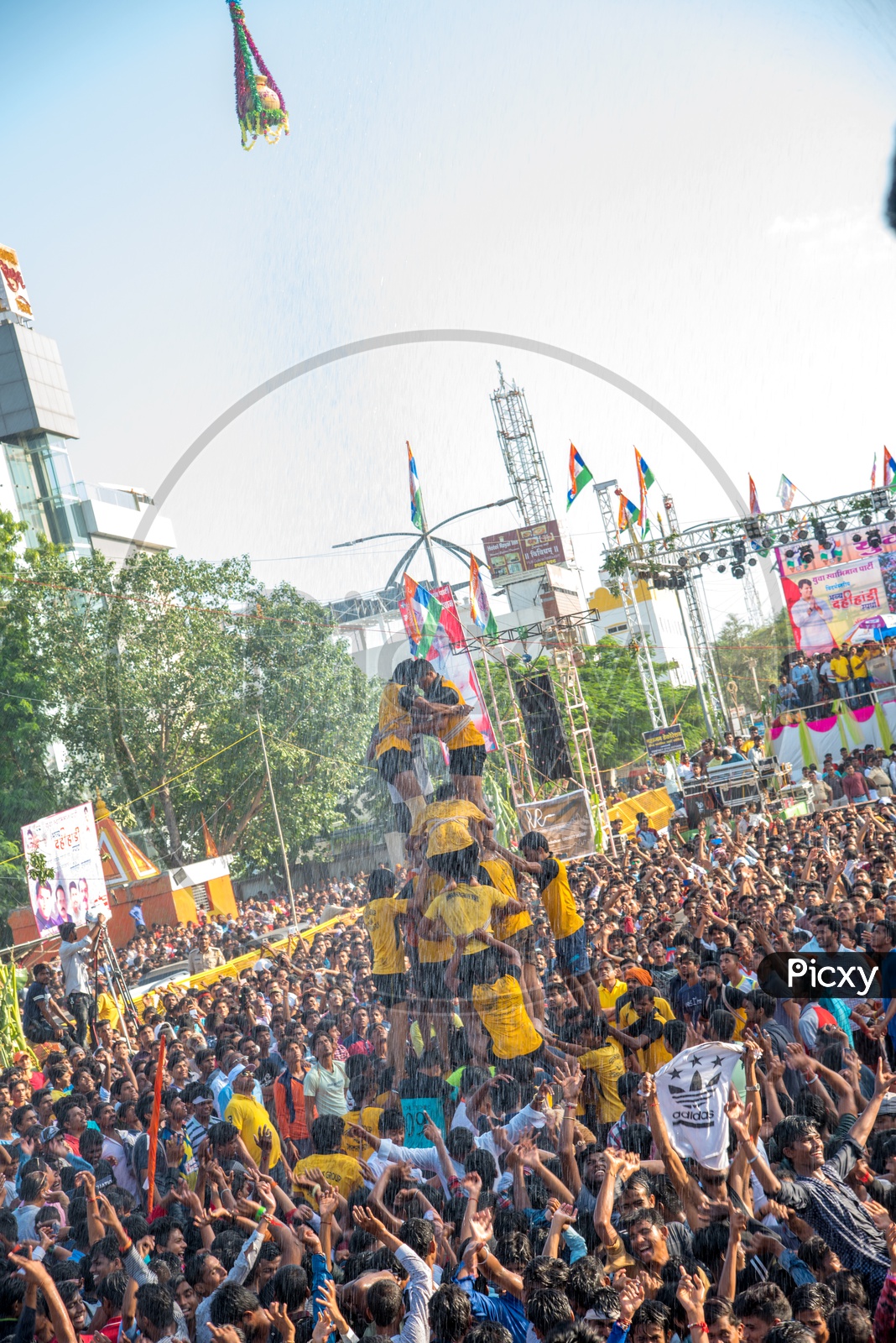 Image of Crowd Of Young Indian People Enjoying Making Human Pyramid At ...