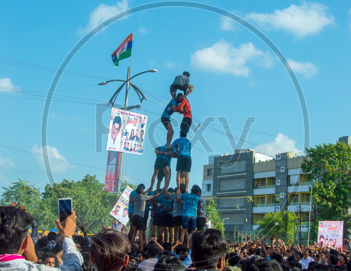 Image of Crowd Of Young Indian People Enjoying Making Human Pyramid At ...