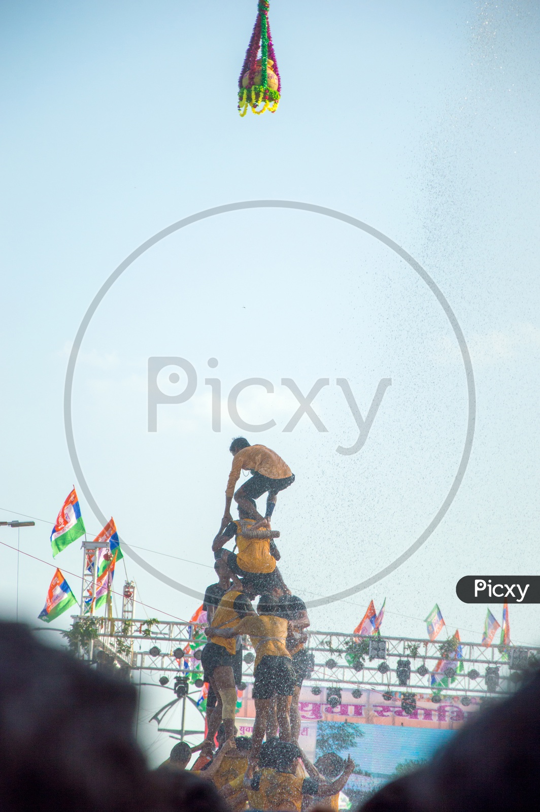 Image of Crowd Of Young Indian People Enjoying Making Human Pyramid At ...
