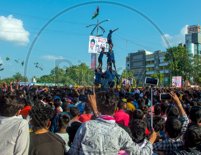 Image of Crowd Of Young Indian People Enjoying Making Human Pyramid At ...