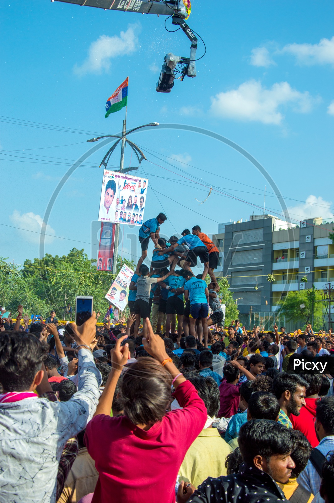 Image of Crowd Of Young Indian People Enjoying Making Human Pyramid At ...