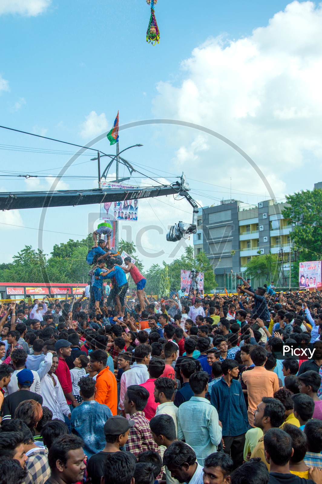 Image of Crowd Of Young Indian People Enjoying Making Human Pyramid At ...