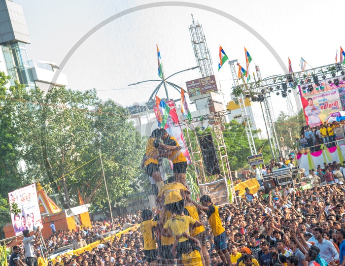 Image of Crowd Of Young Indian People Enjoying Making Human Pyramid At ...