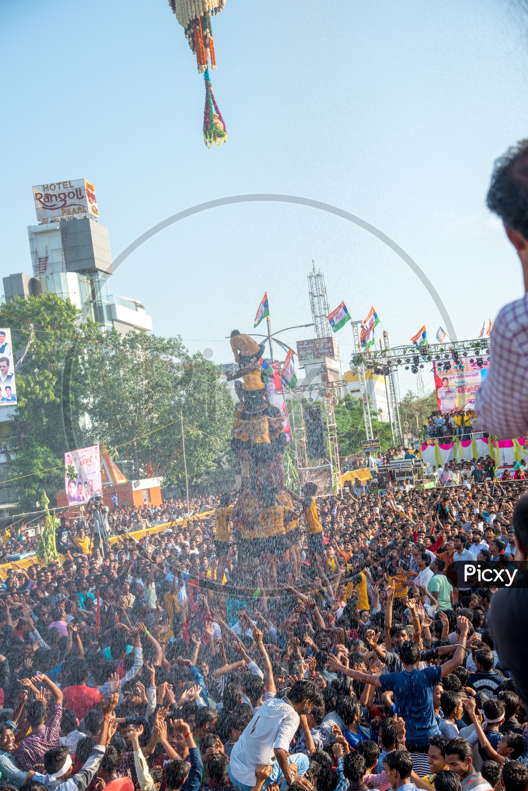 Image of Crowd Of Young Indian People Enjoying Making Human Pyramid At ...