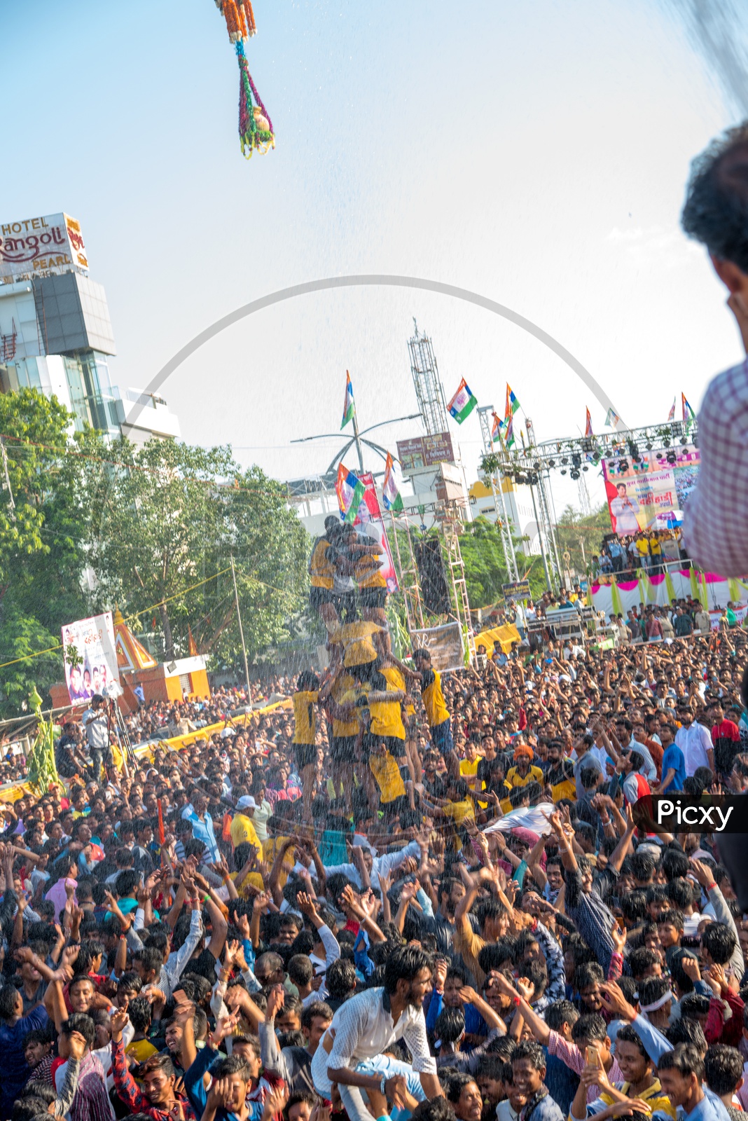 Image of Crowd Of Young Indian People Enjoying Making Human Pyramid At ...