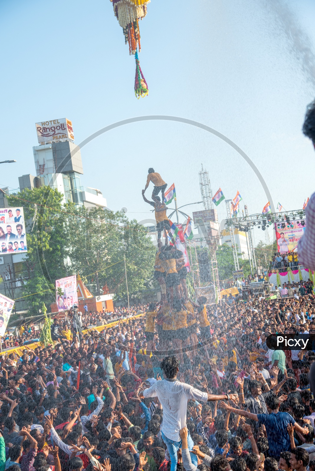 Image of Crowd Of Young Indian People Enjoying Making Human Pyramid At ...