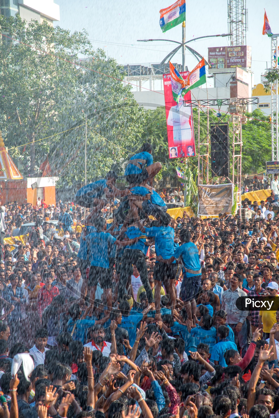 Image of Crowd Of Young Indian People Enjoying Making Human Pyramid At ...