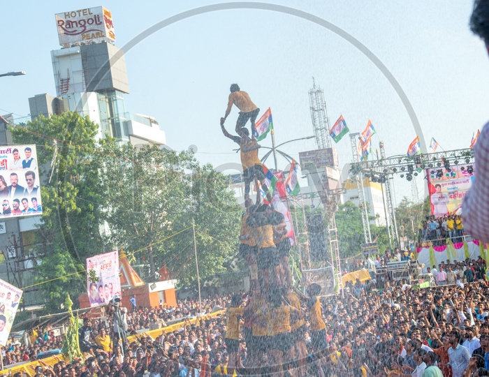 Image of Crowd Of Young Indian People Enjoying Making Human Pyramid At ...