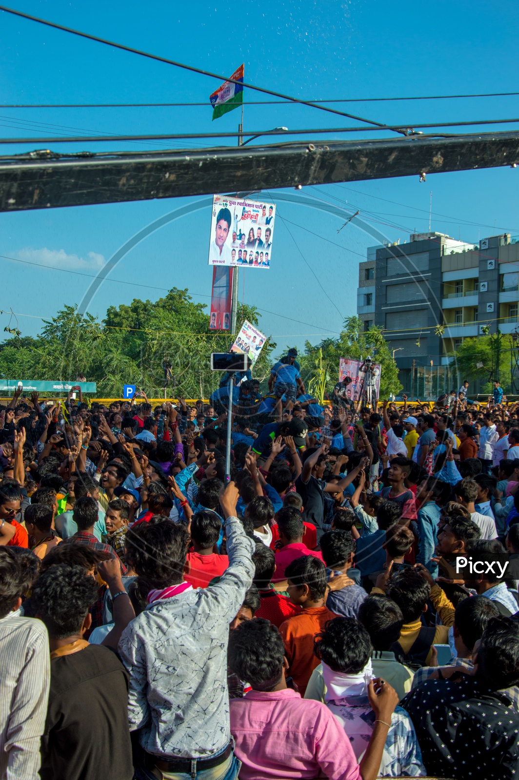 Image of Crowd Of Young Indian People Enjoying Making Human Pyramid At ...